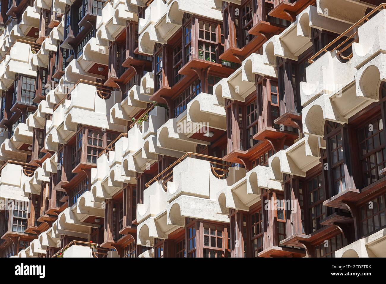 Geometric picturesque building facade in concrete and wood ...