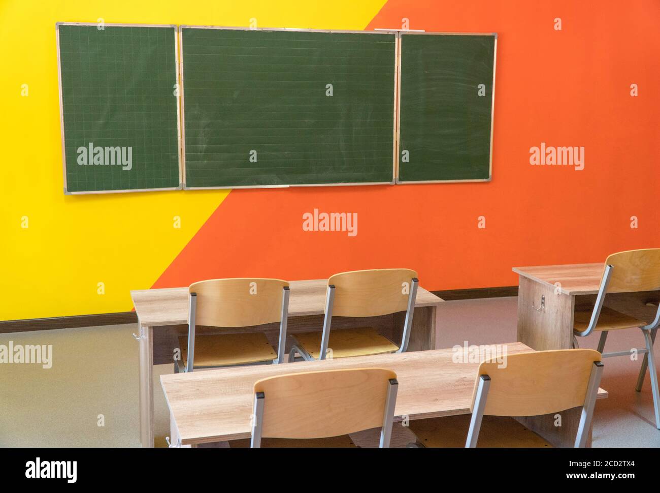 An empty school classroom with a blackboard. Interior of a school ...