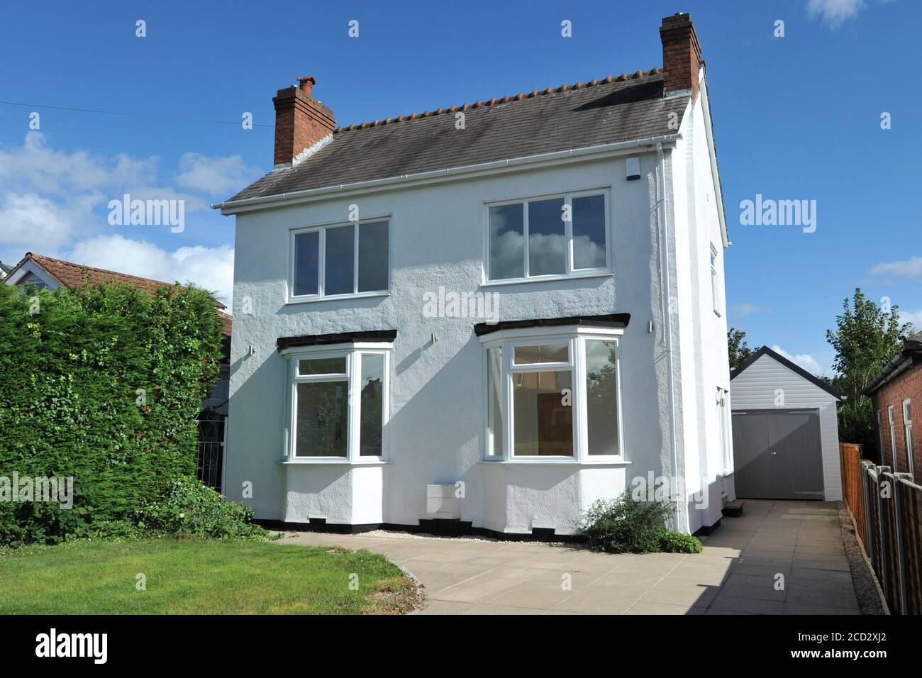 Exterior of house with white render Stock Photo - Alamy