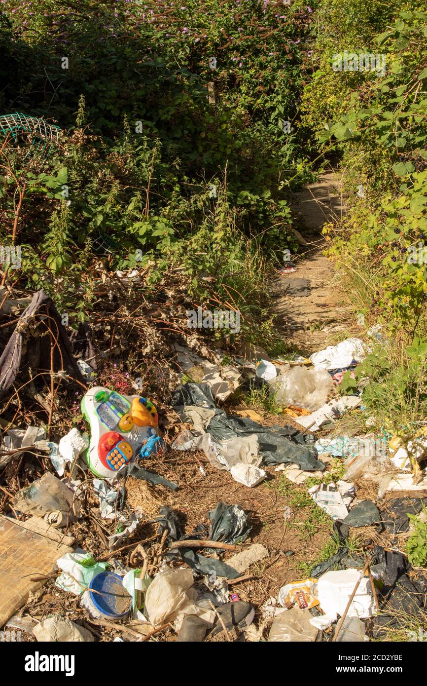 Unlawful fly-tipping as environmental destruction Stock Photo - Alamy