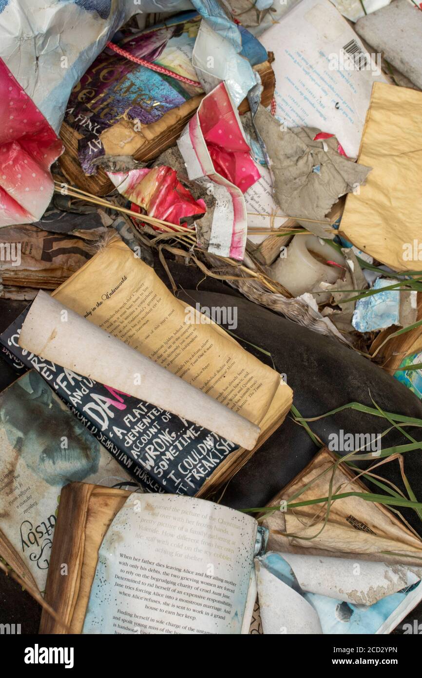 Casually discarded household waste littering an alleyway, environmental ...