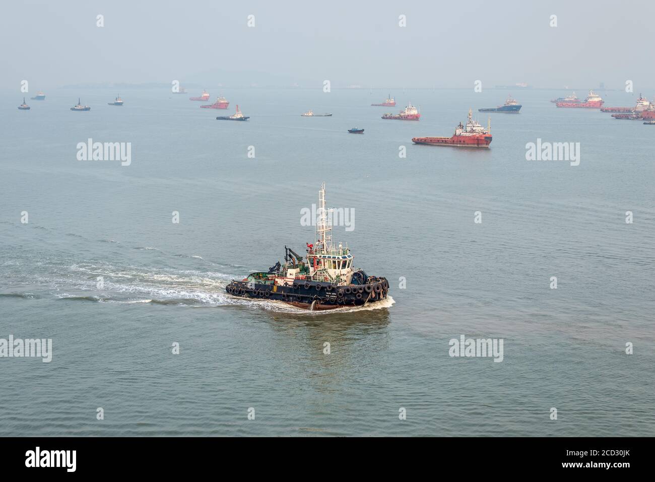 Mumbai, India - November 22, 2019: The tug KNK ASHIMA sails in the bay ...
