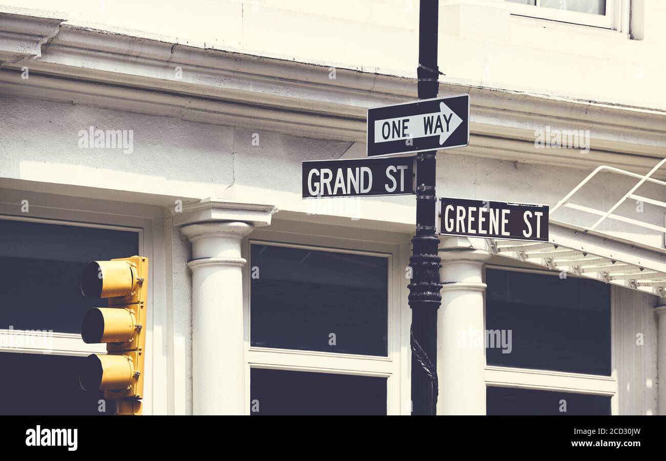 Grand and Greene Street signs in New York City, color toning applied ...