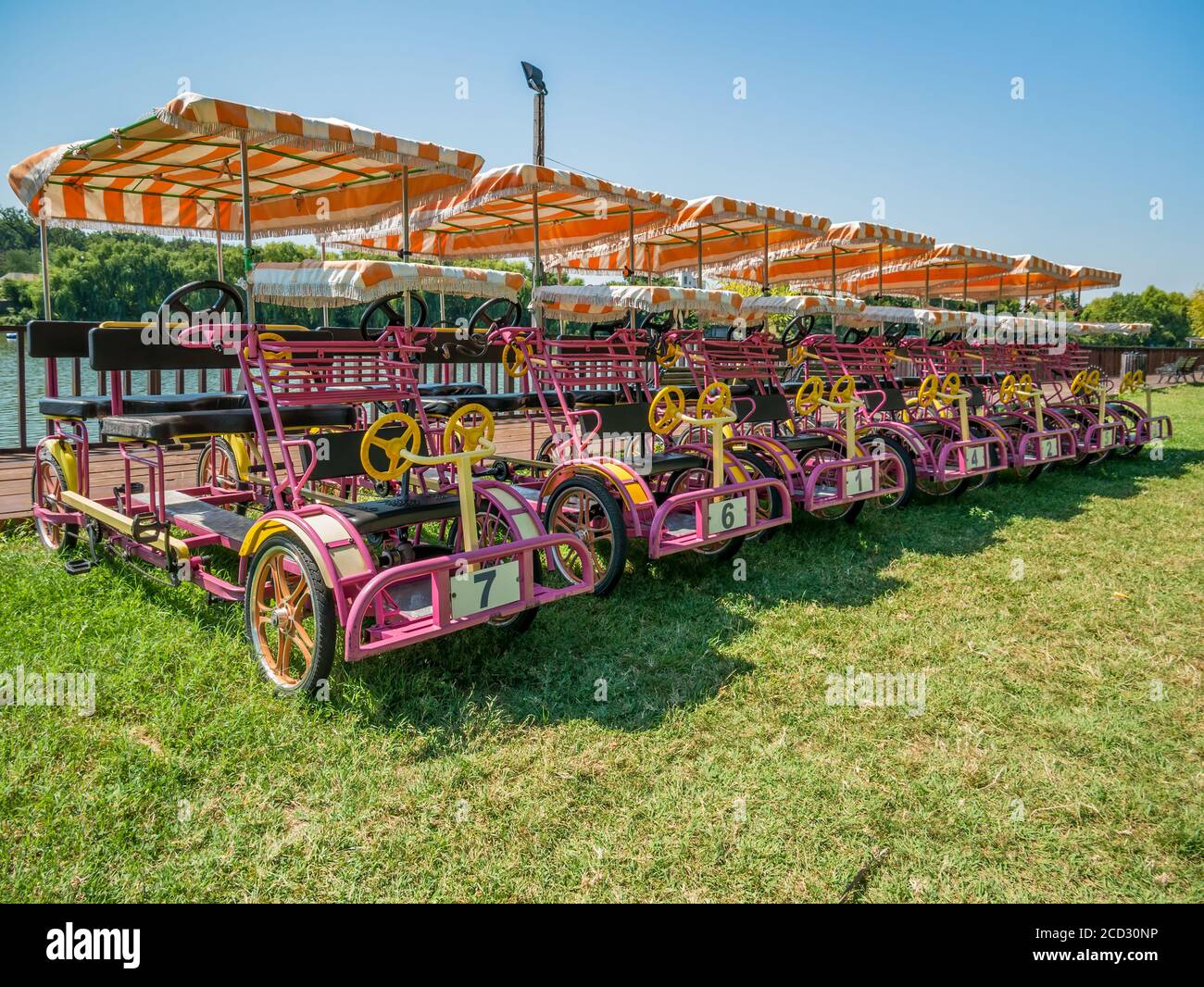 Four wheel sightseeing tourist go carts with pedals Stock Photo - Alamy