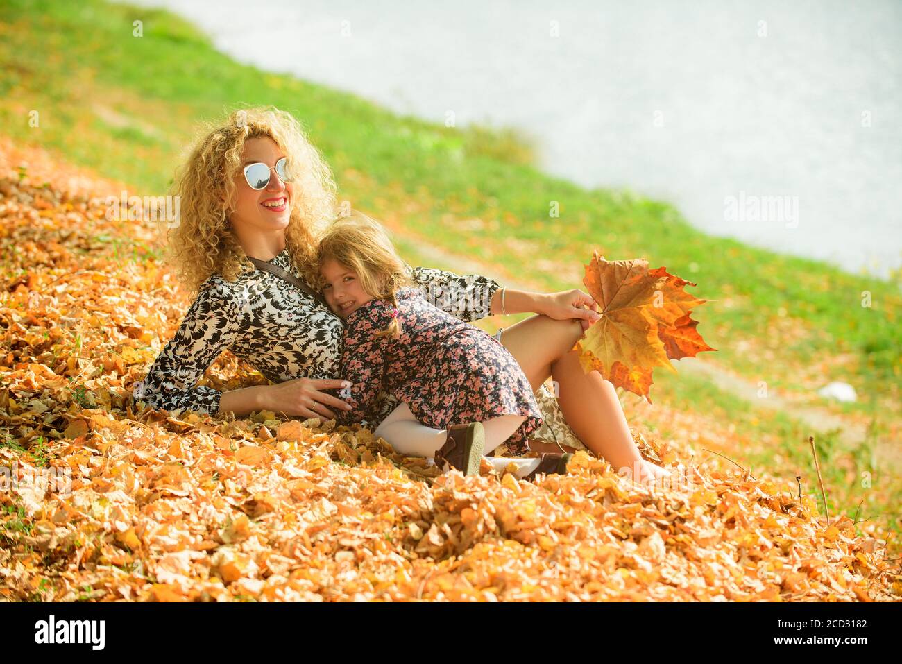 Mother and daughter hugging. Autumn fall time in nature. Family on ...