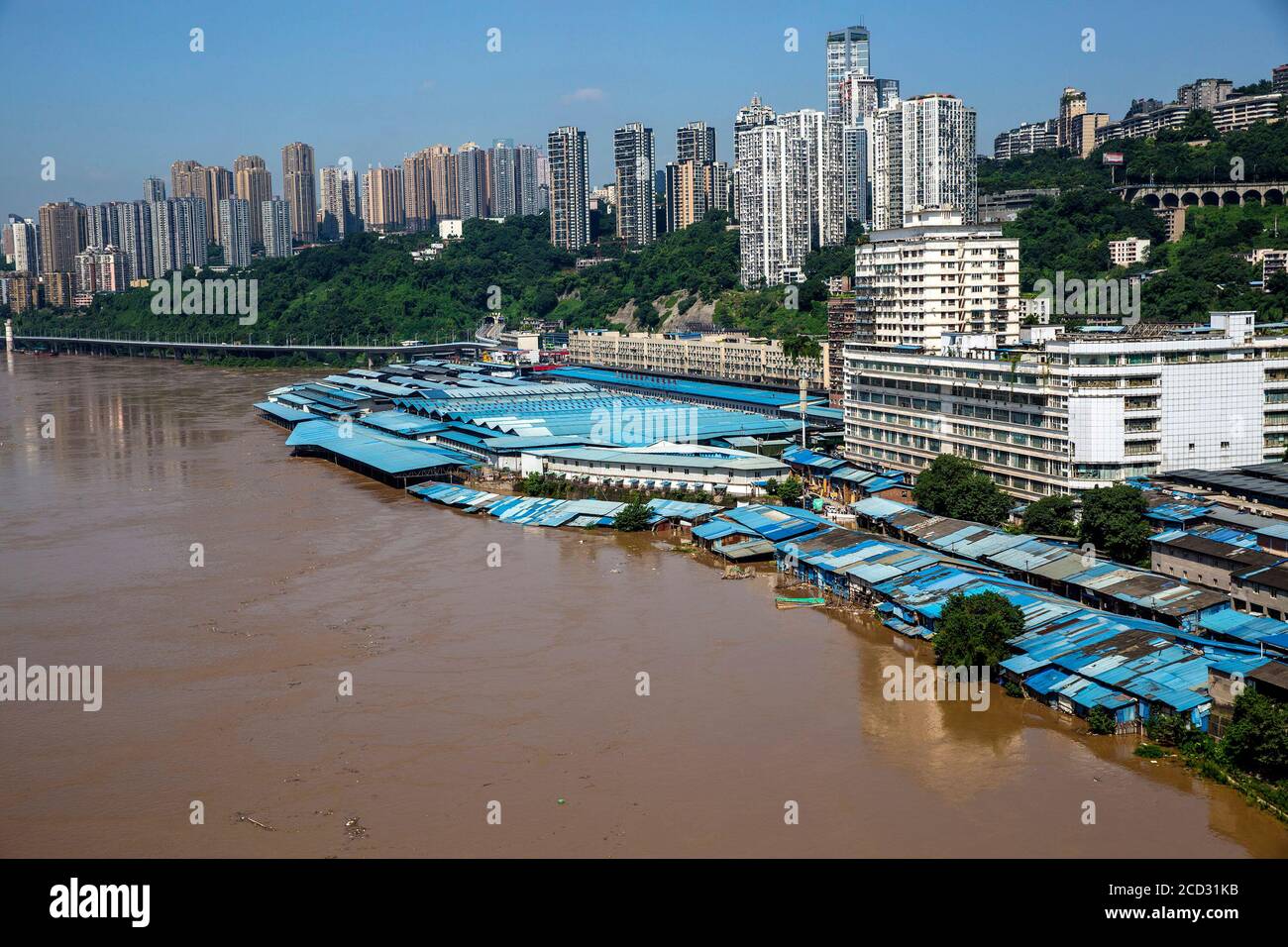 A market is flooded by rising water of Jialing River, a major tributary ...