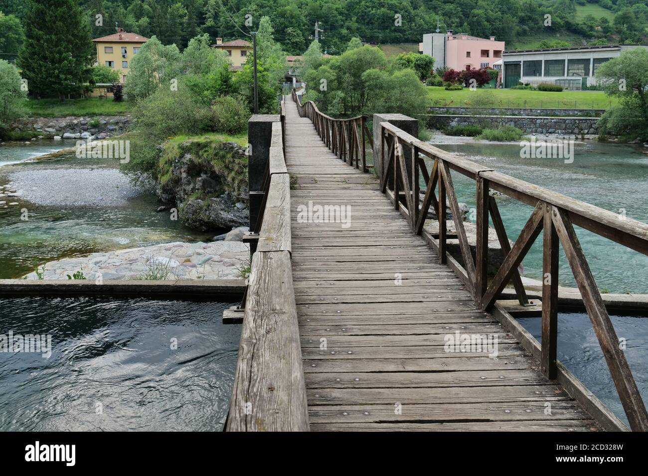 Souspended wood bridge on river Serio in Villa d'Ogna, Bergamo Stock ...