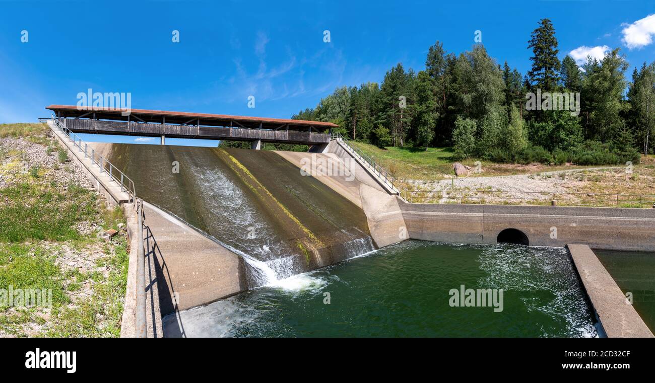 Overflow with pedestrian bridge at the dam Nagoldtalsperre, Germany ...