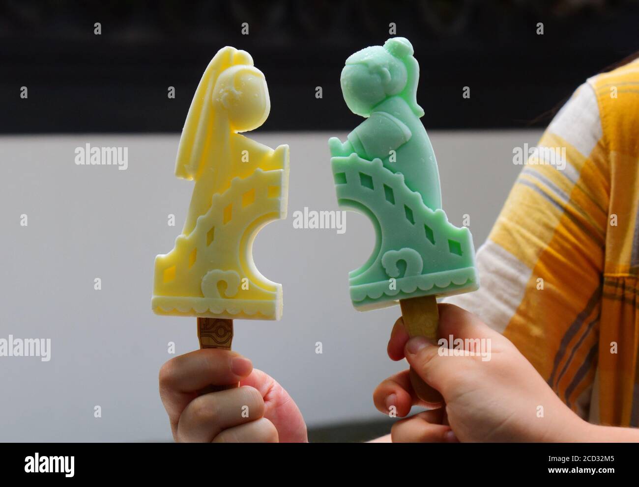 A person shows ice cream of "Madame White Snake" and "Xu Xian", the ...