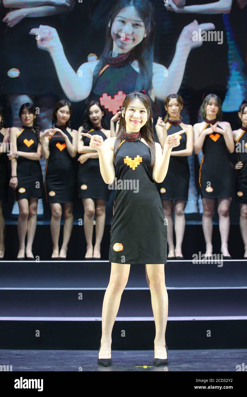 Beautiful cosplayers are seen posing and performing in clothes shown in ...