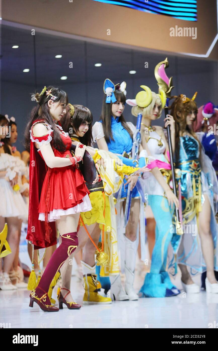 Beautiful cosplayers are seen posing and performing in clotThes shown ...