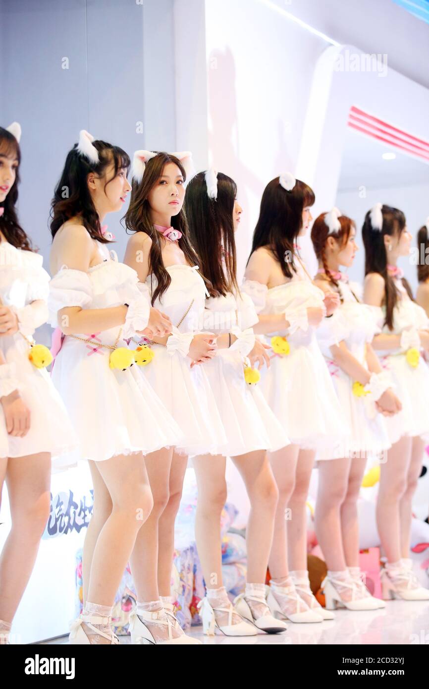 Beautiful cosplayers are seen posing and performing in clotThes shown ...