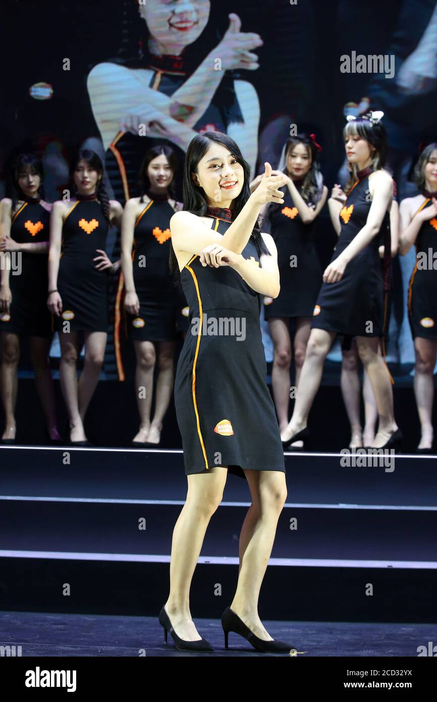 Beautiful cosplayers are seen posing and performing in clothes shown in ...