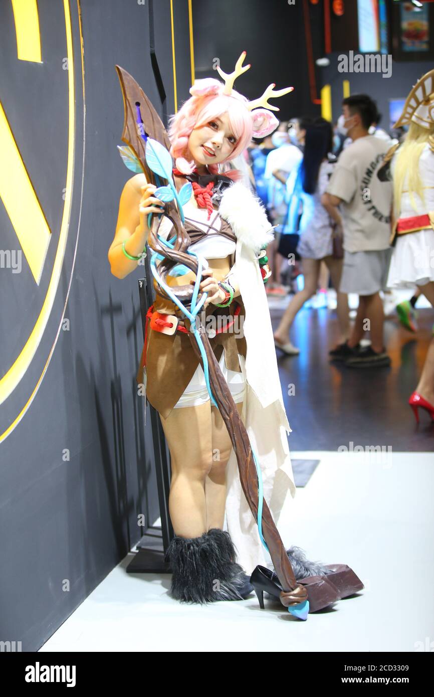 Beautiful cosplayers are seen posing and performing in clotThes shown ...