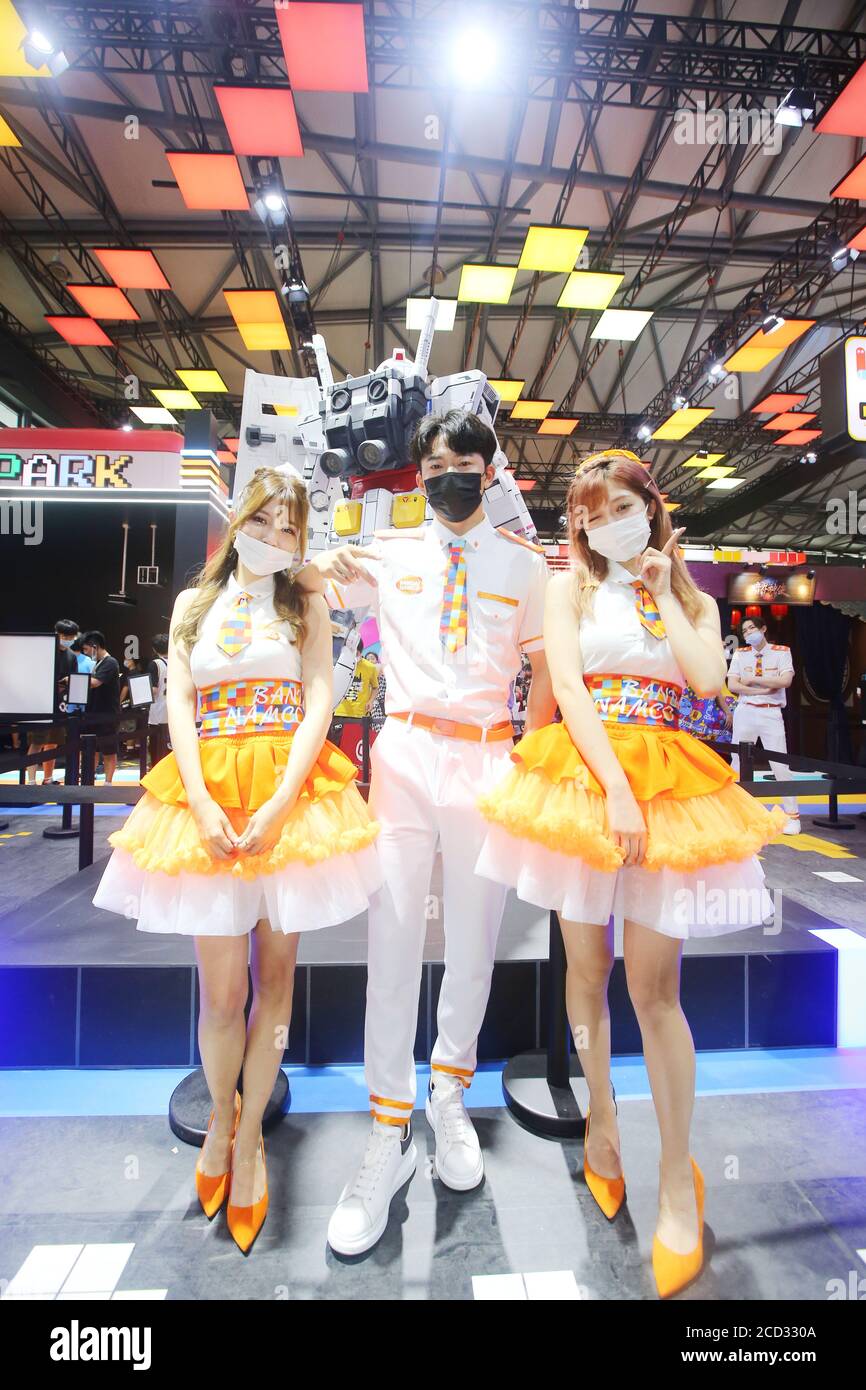 Beautiful cosplayers are seen posing and performing in clotThes shown ...