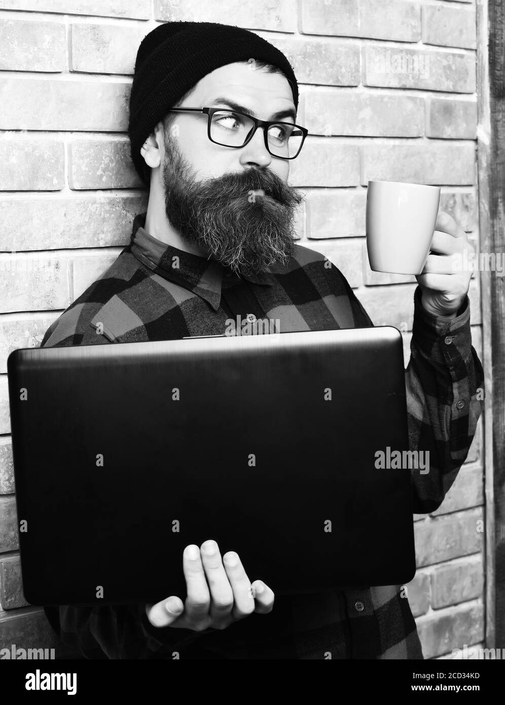 Man in beige hat Black and White Stock Photos & Images - Alamy