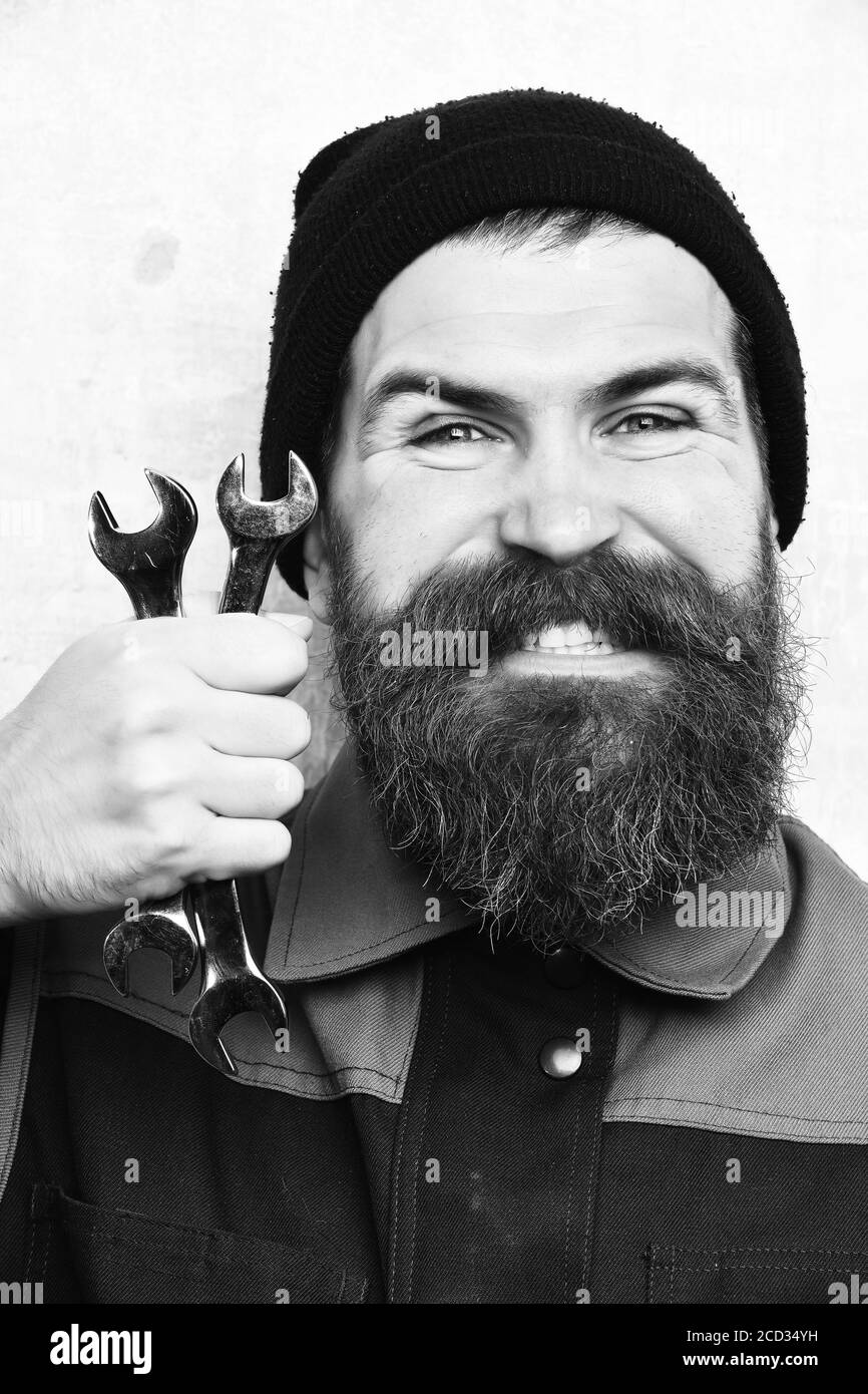 Bearded man, long beard. Brutal caucasian mechanic, smiling happy ...