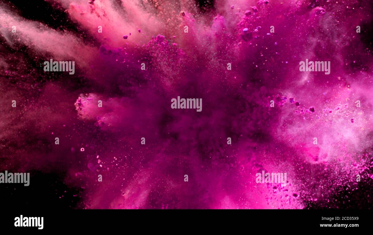 Explosion of coloured powder isolated on black background. Abstract ...