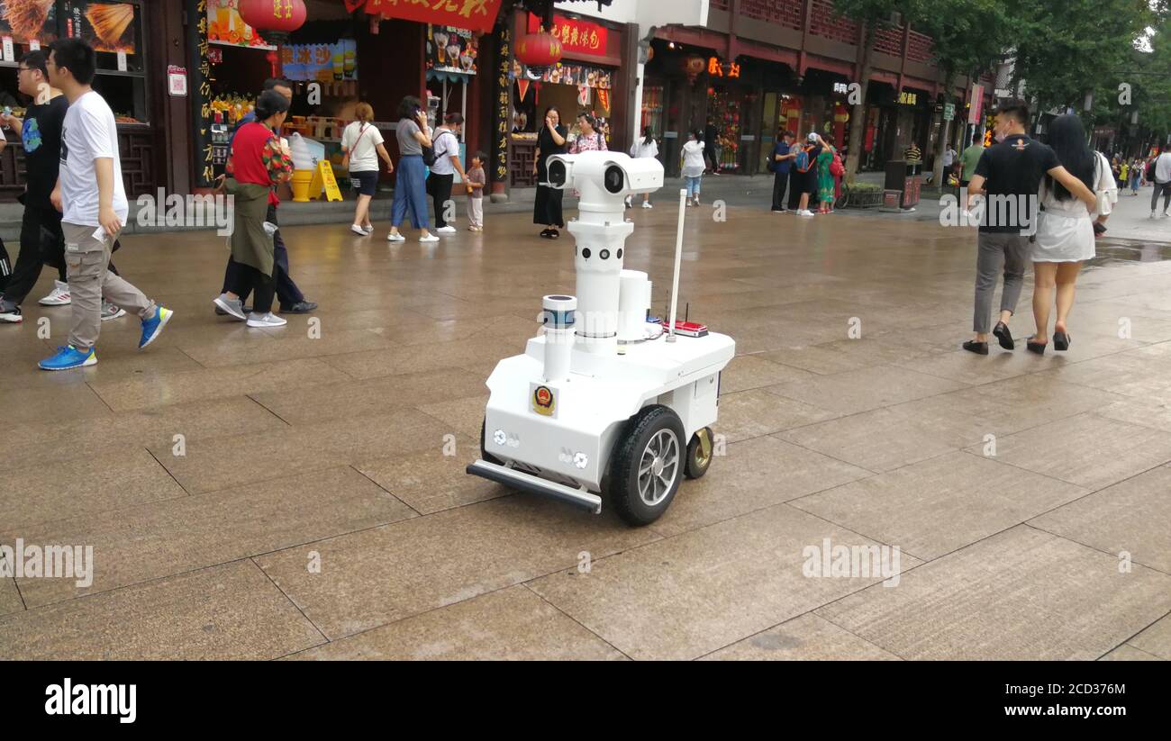 An unmanned patrol robot is patrolling on the street of the Confucius ...