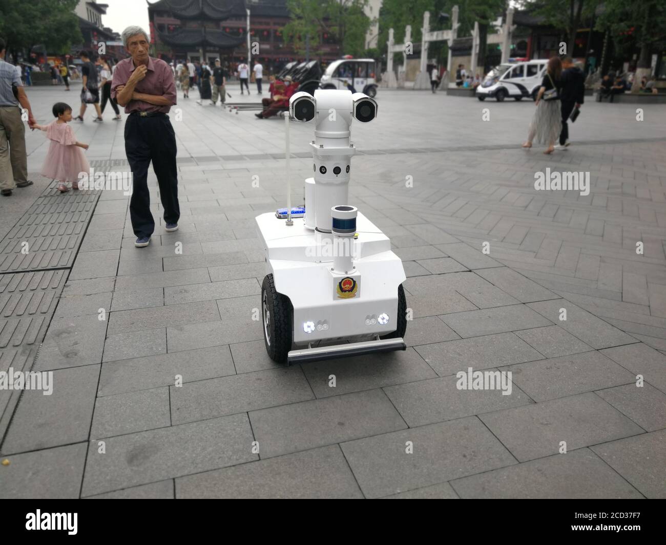 An unmanned patrol robot is patrolling on the street of the Confucius ...