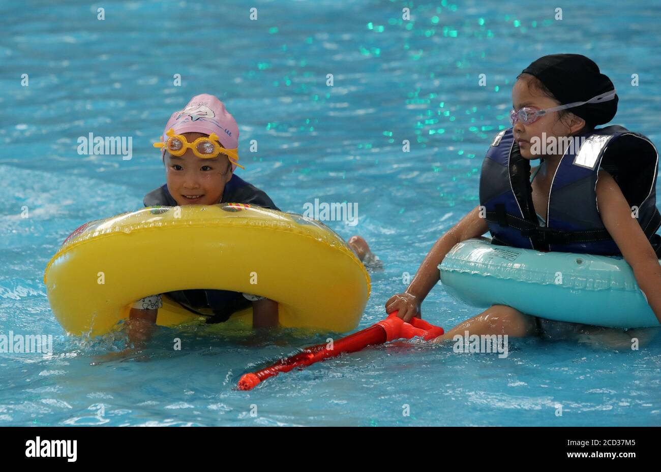 Citizens enjoy water and various aquatic activities to relieve from scorching summer heat as the ...