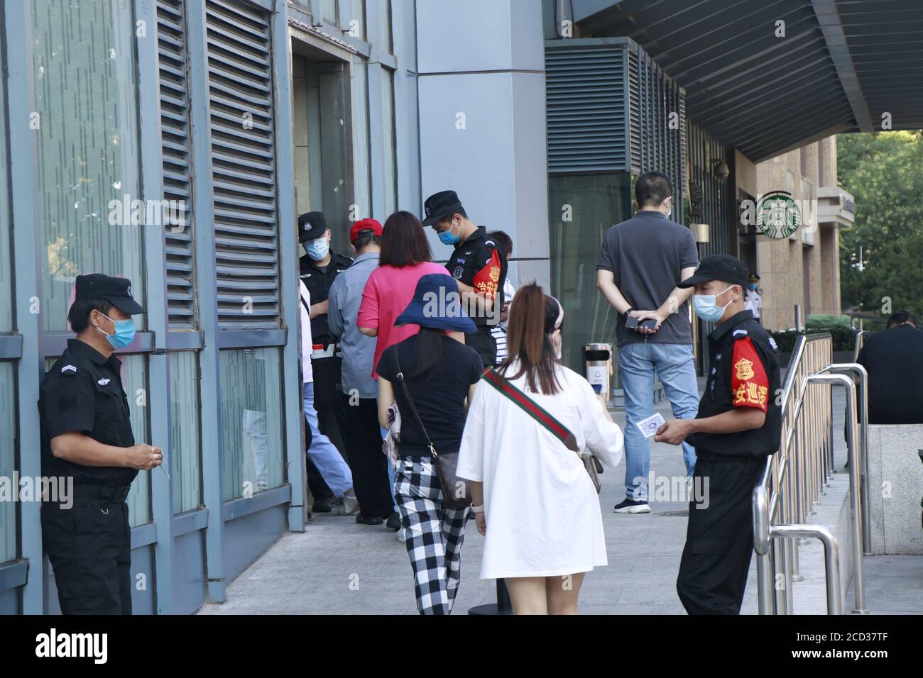 People line up to get into the Capital Cinema in Beijing, China, 24 ...