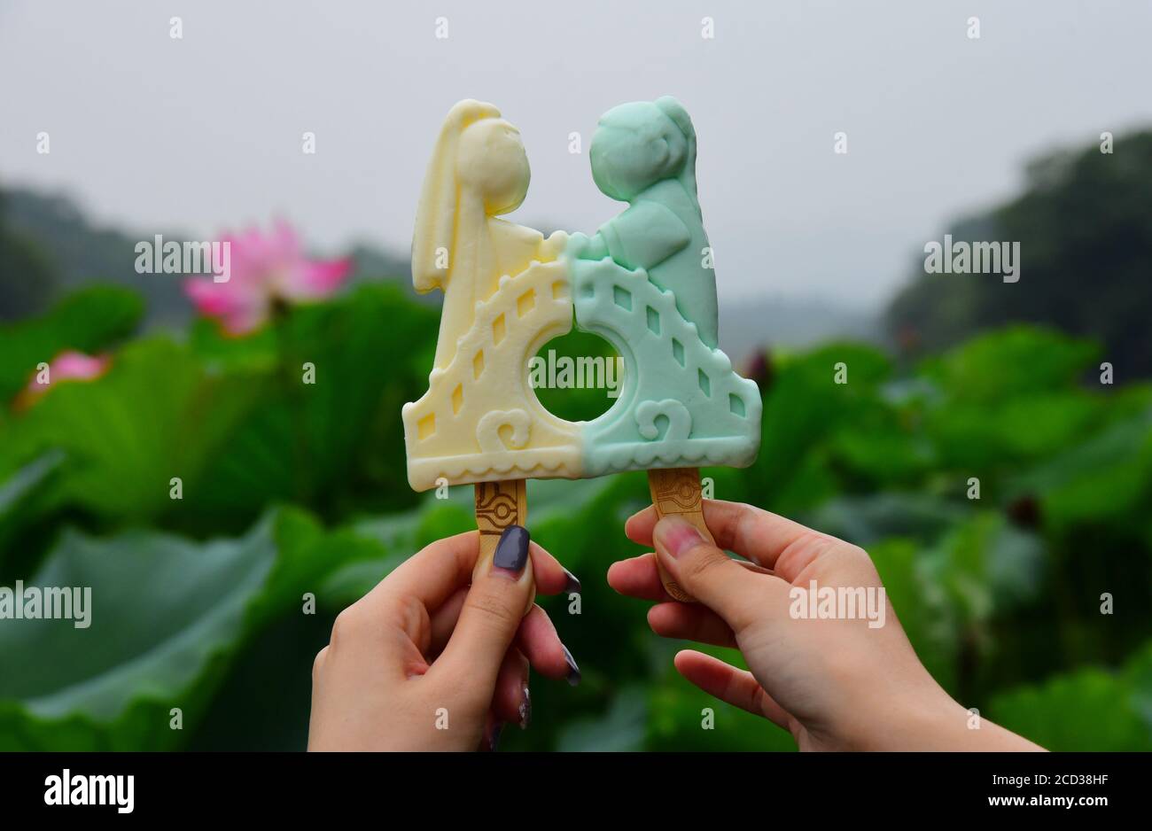 A person shows ice cream of "Madame White Snake" and "Xu Xian", the ...