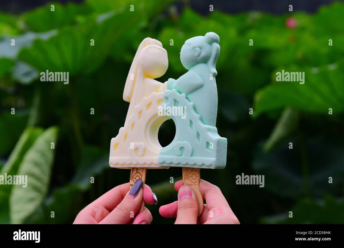 A person shows ice cream of "Madame White Snake" and "Xu Xian", the ...