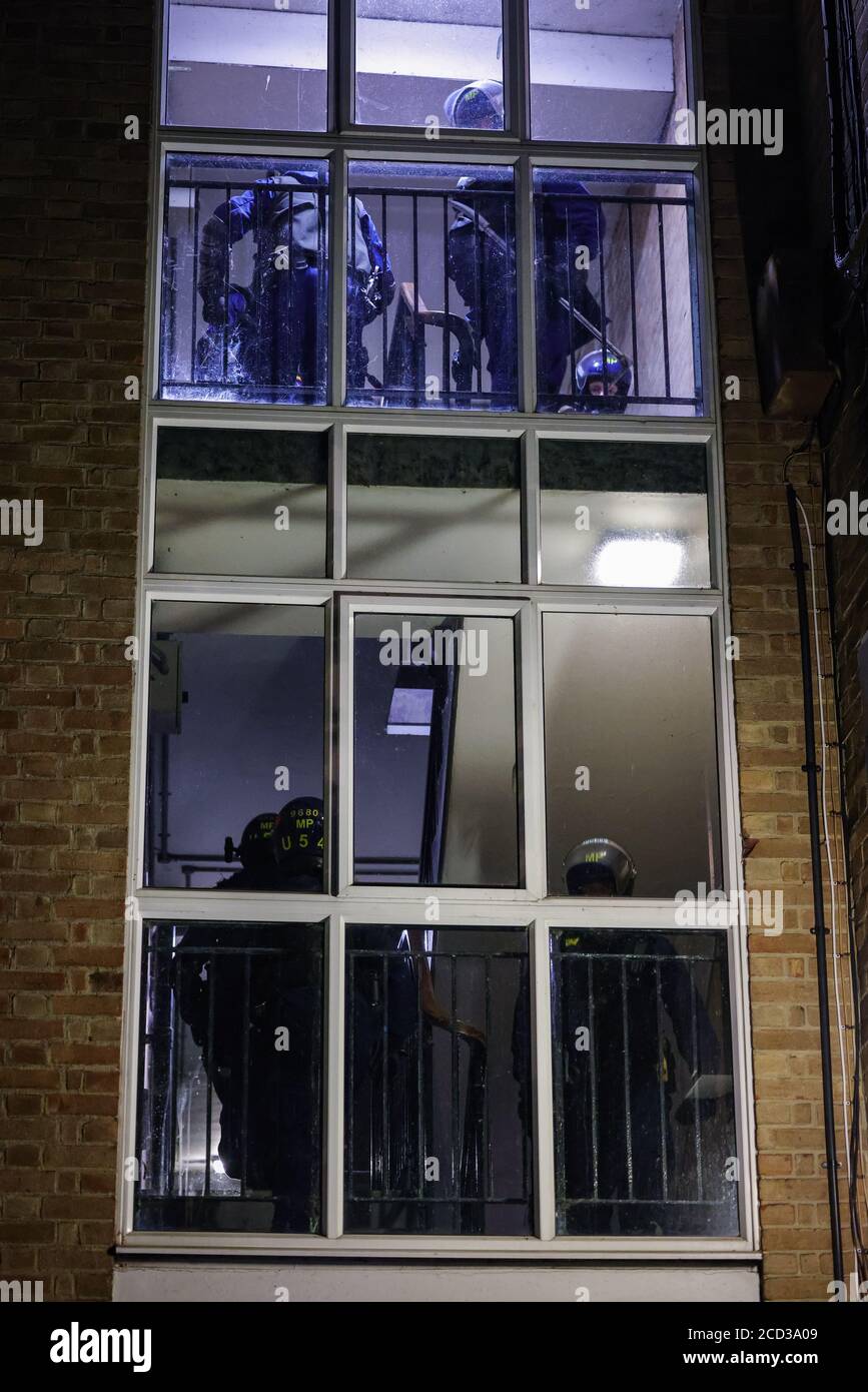 Metropolitan Police officers raid a property on St Albans Road in ...