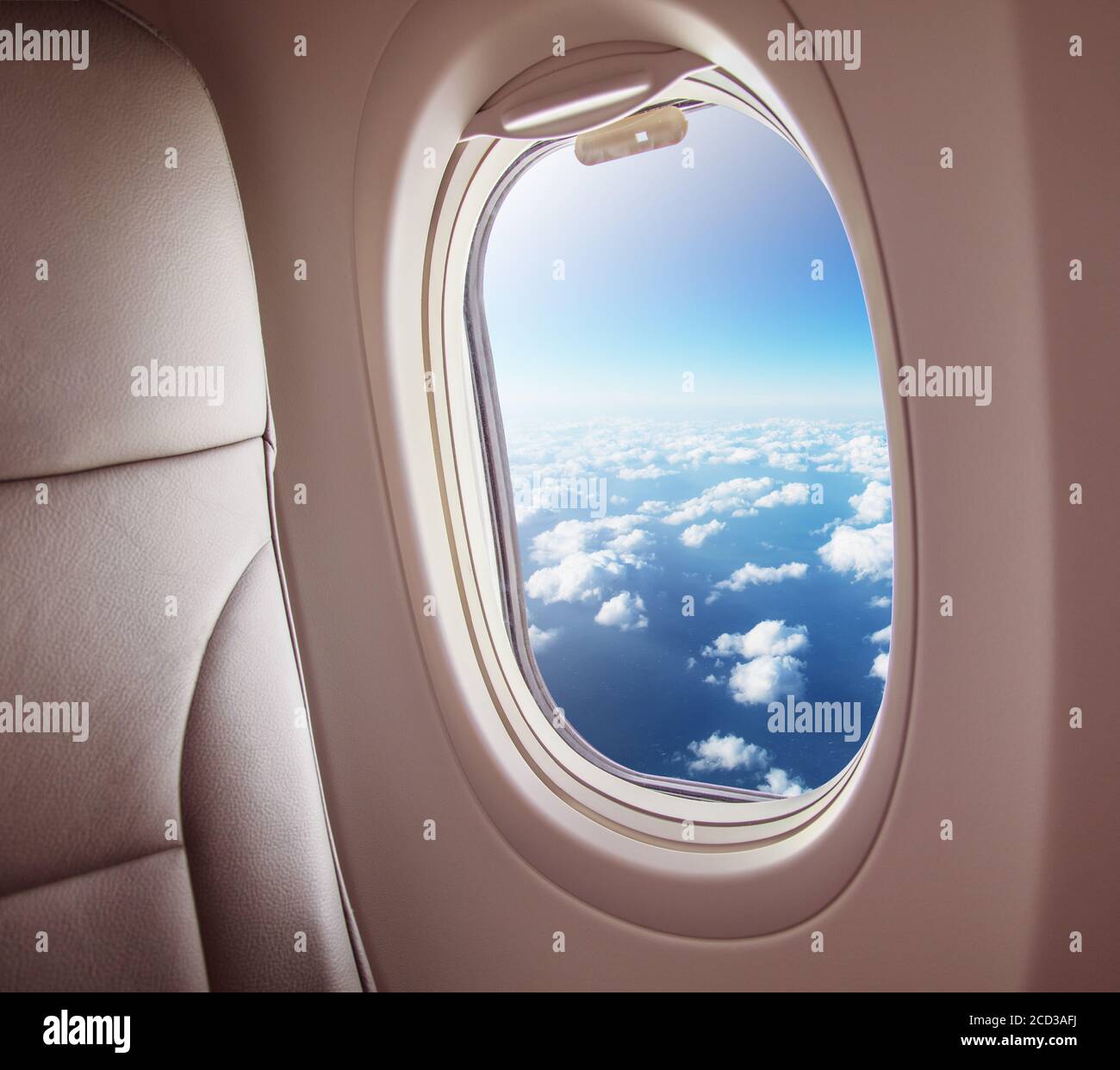 Airplane interior with window view of clouds. Concept of travel and air ...