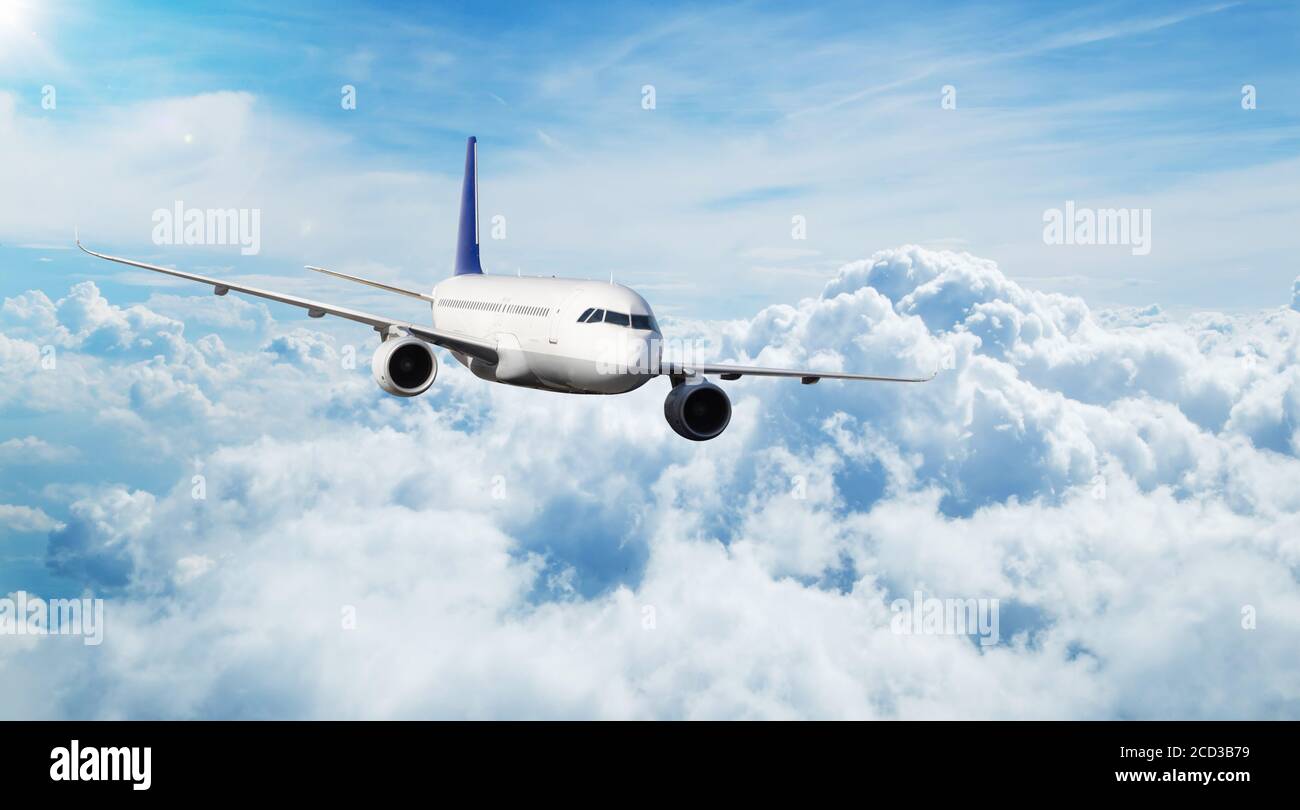 Commercial airplane jetliner flying above clouds. Transportaton and ...