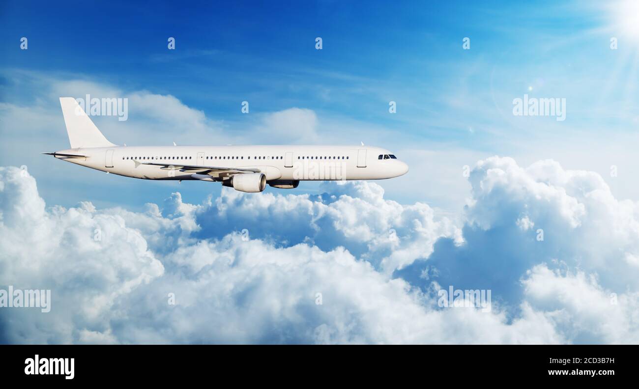 Commercial airplane jetliner flying above clouds. Transportaton and ...