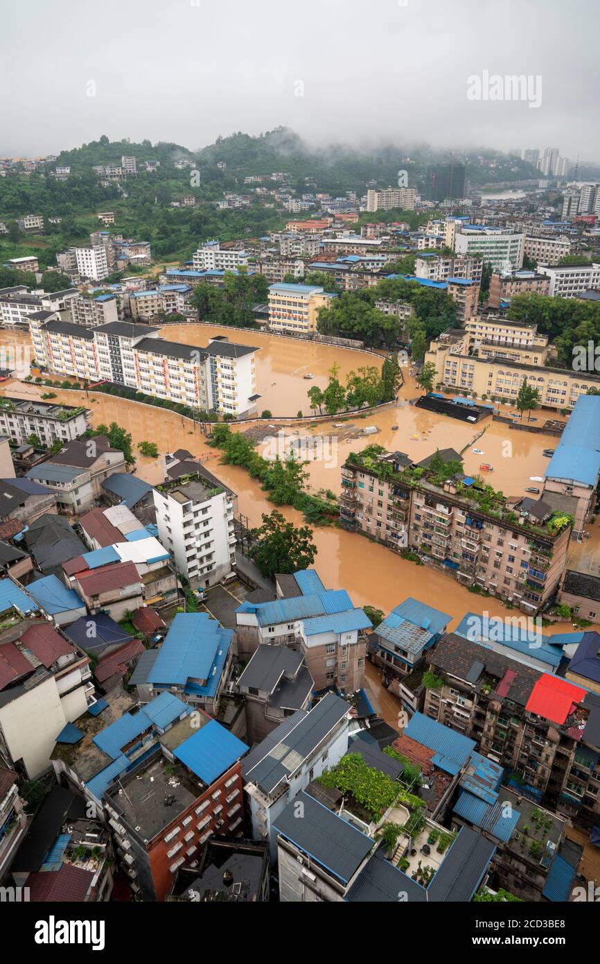 An aerial view of department buildings submerged by flood in Enshi ...