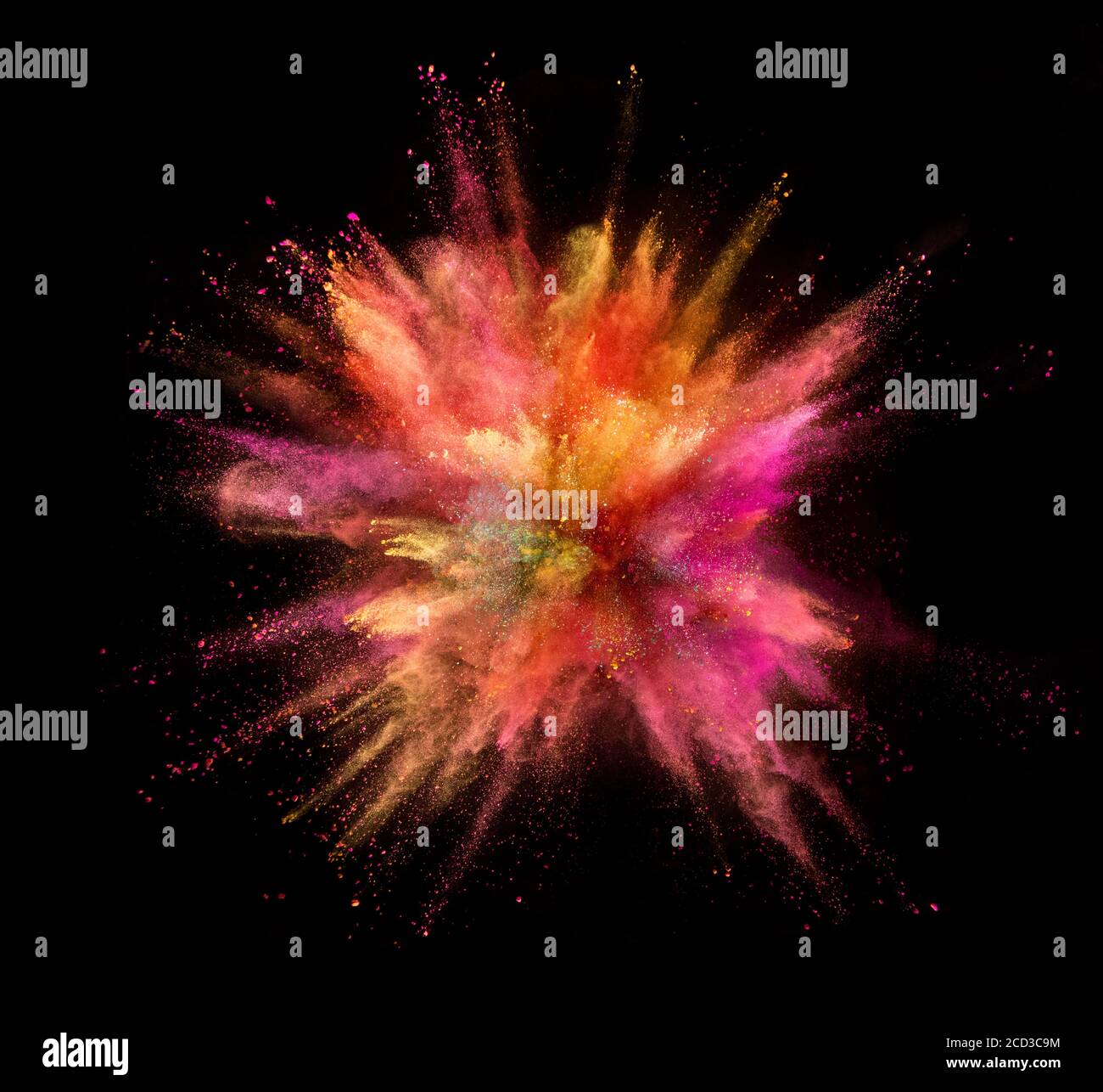 Explosion of coloured powder isolated on black background. Freeze ...