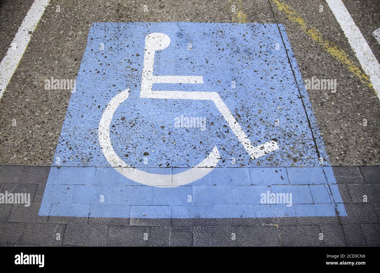 Handicapped sign on the asphalt, information for disabled people ...
