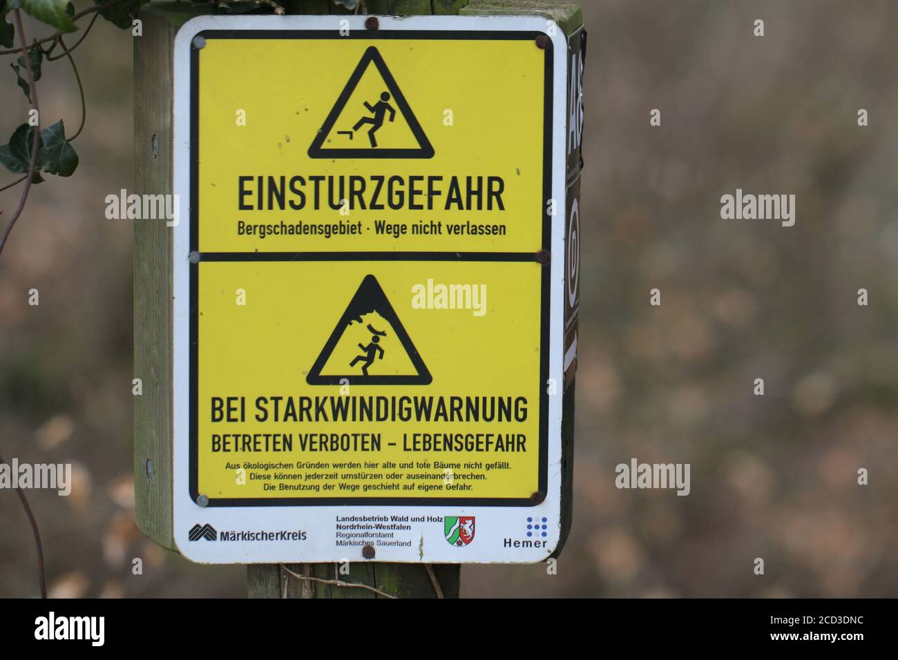 warning sign against storm and mining damage, Germany Stock Photo - Alamy