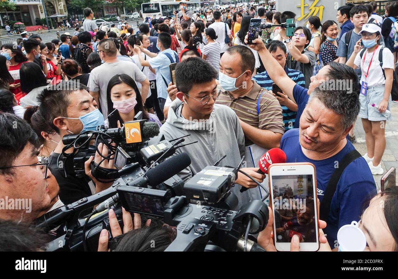 53-year-old Chinese man Liang Shi steps out of the testing center ...