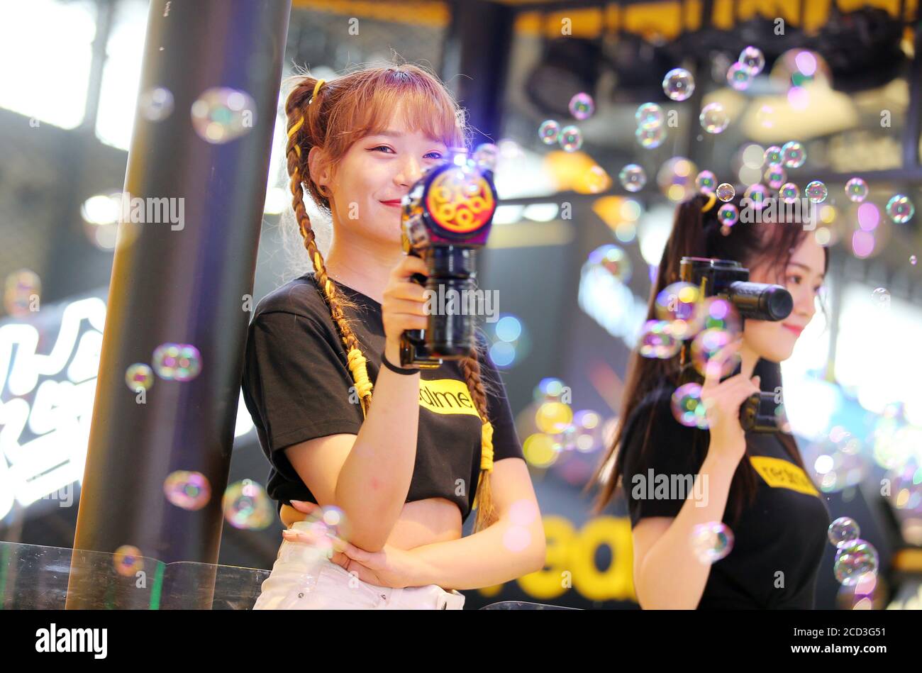 Beautiful cosplayers are seen posing and performing in clotThes shown ...