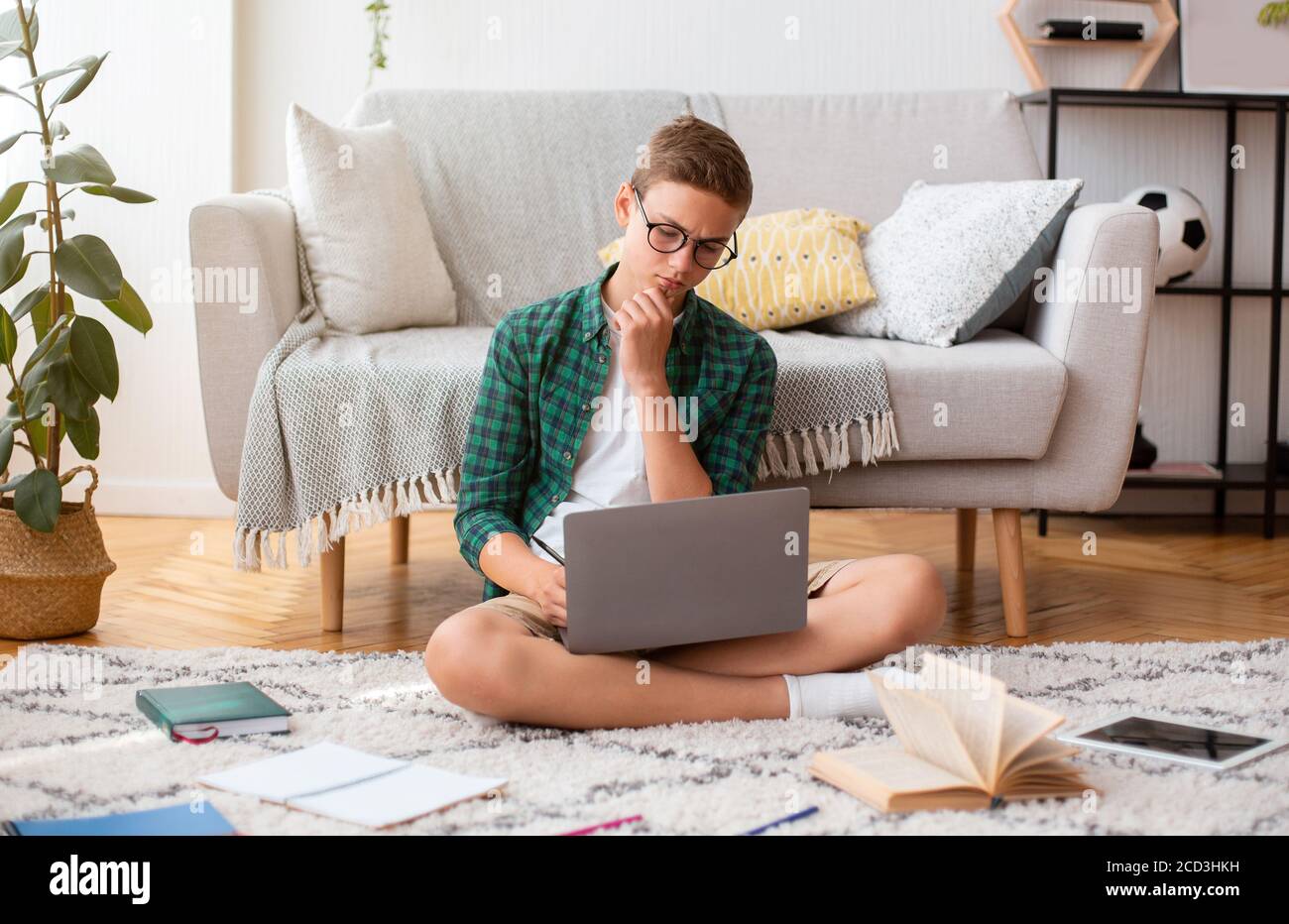 Teen boy studying books hi-res stock photography and images - Alamy