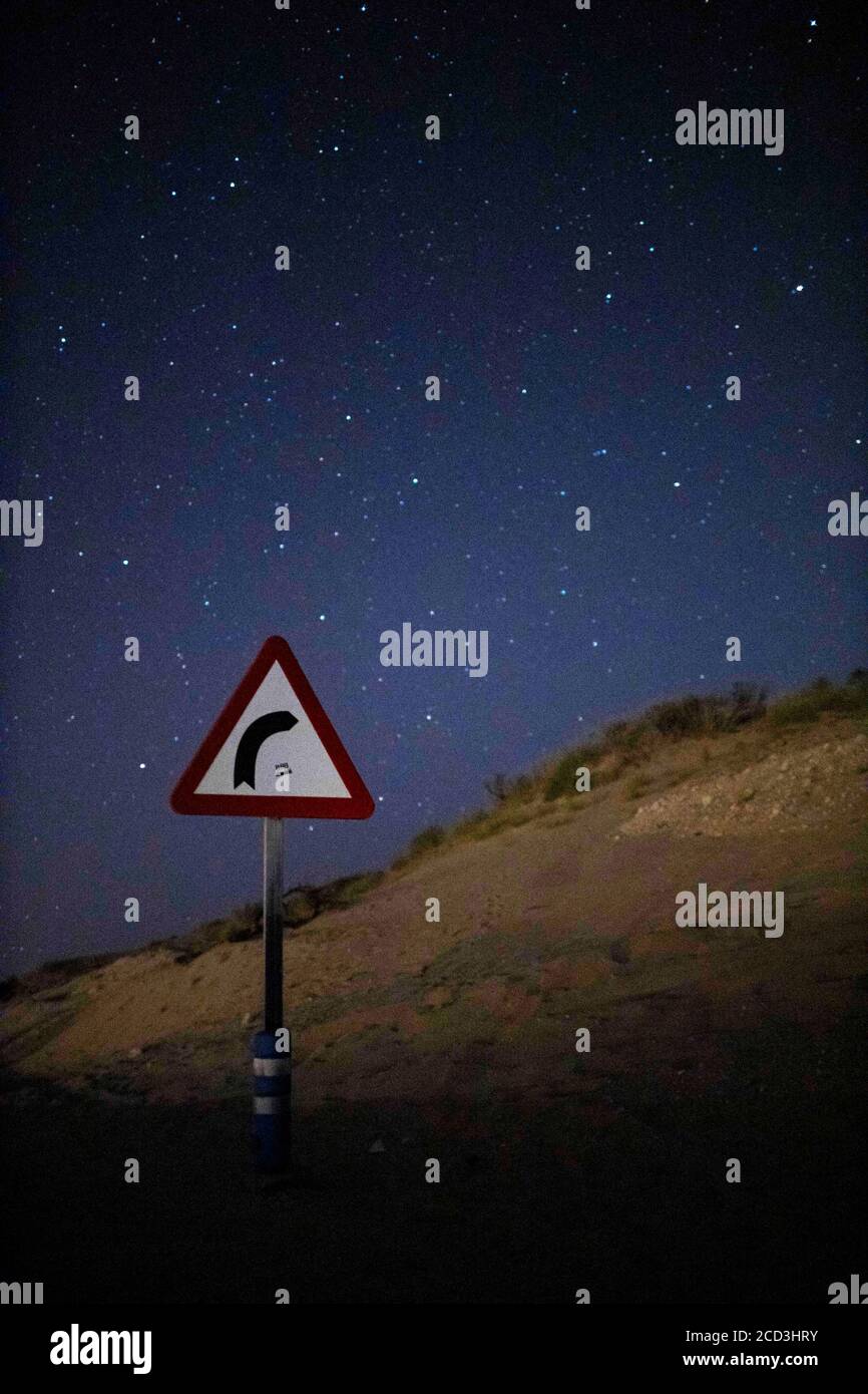 Road curve sign in the countryside and a star-filled sky Stock Photo ...