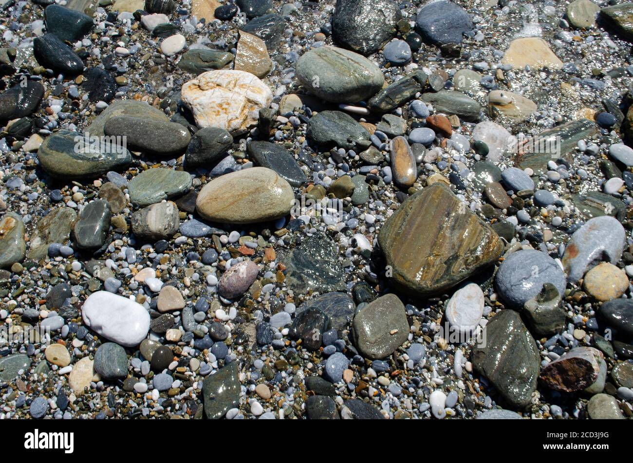 Rounded grey granite rocks beach hi-res stock photography and images ...