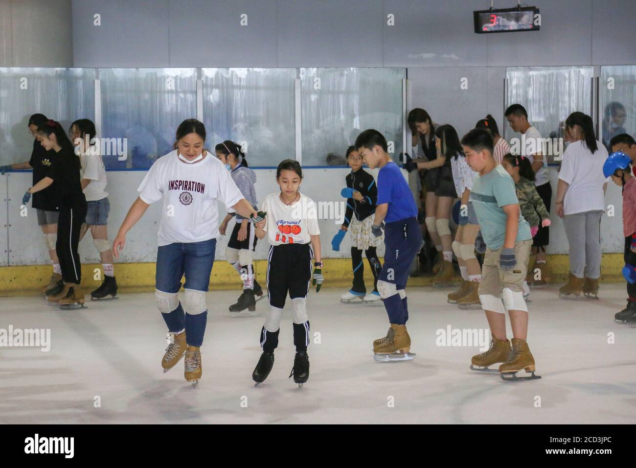 Citizens enjoy skating at an indoor ice rink to relieve scorching ...