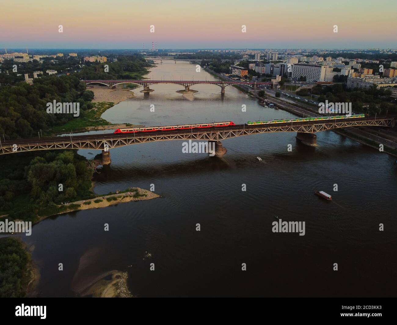 Capital cityscape and a suspension bridge over a large river. Drone ...