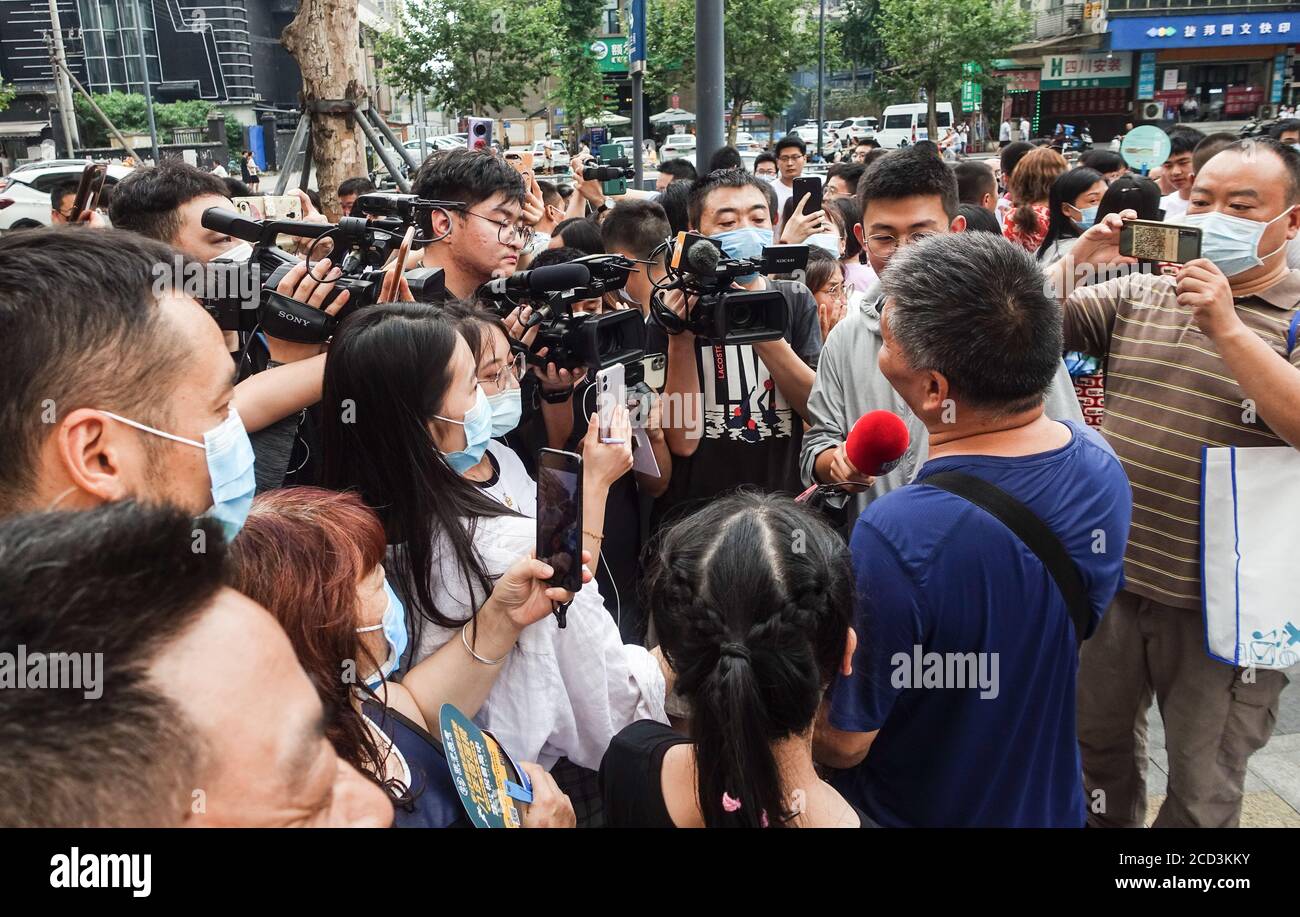 53-year-old Chinese man Liang Shi steps out of the testing center ...