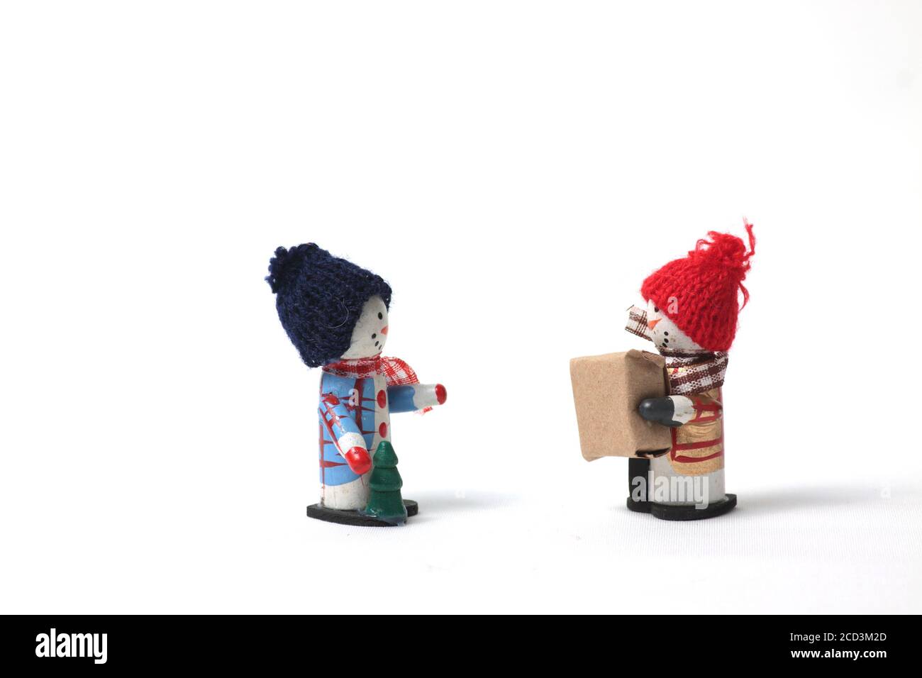 Gives a wrapped box to another person. Present giving or messenger ...