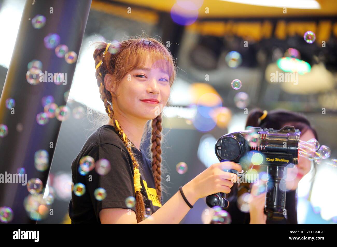 Beautiful cosplayers are seen posing and performing in clotThes shown ...