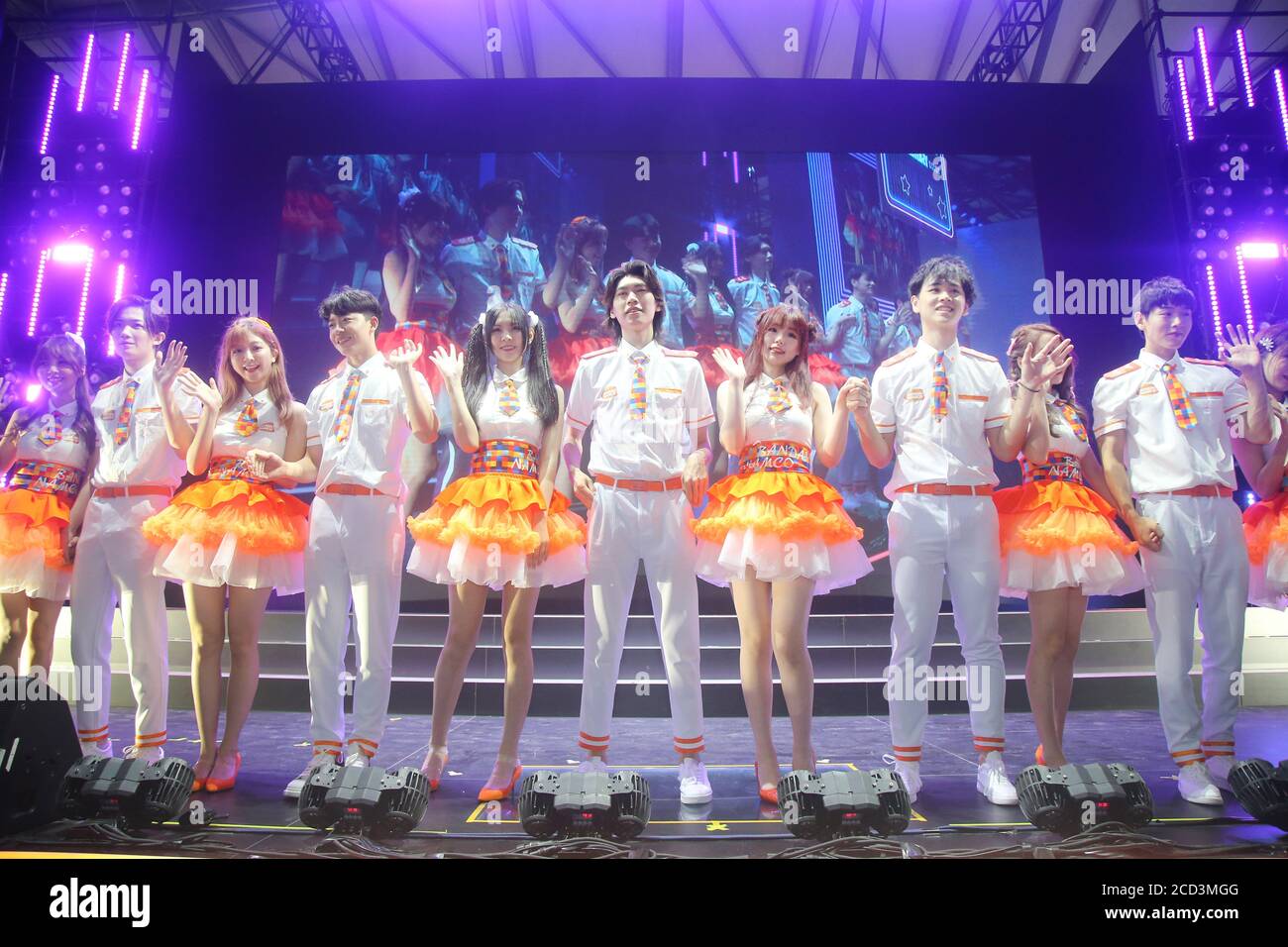 Beautiful cosplayers are seen posing and performing in clothes shown in ...