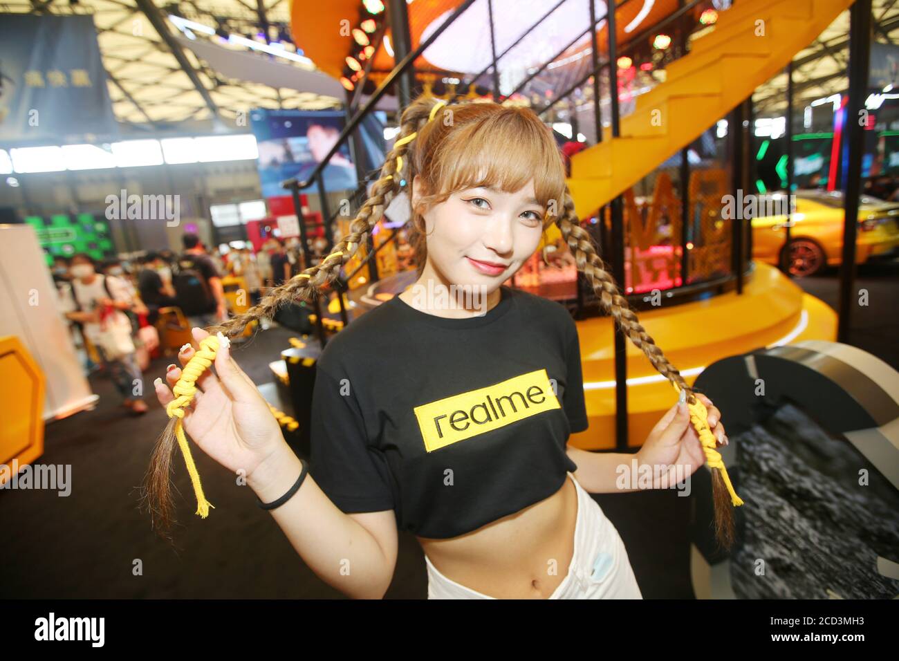 Beautiful cosplayers are seen posing and performing in clothes shown in ...