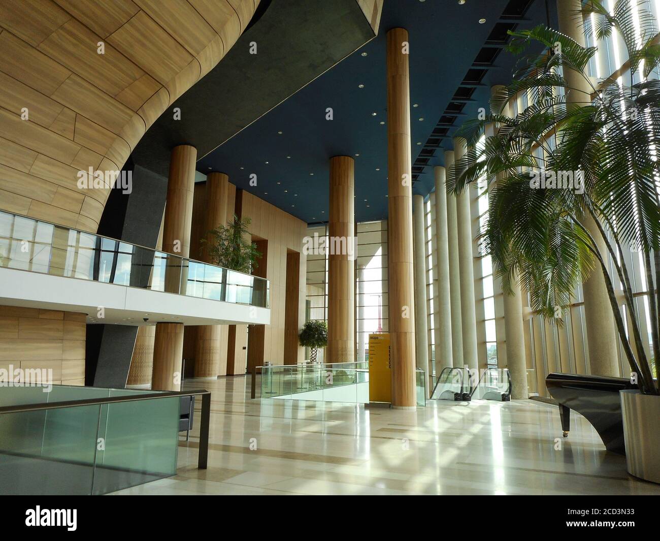 Modern interior with wooden columns, curves wall. Budapest contemporary ...