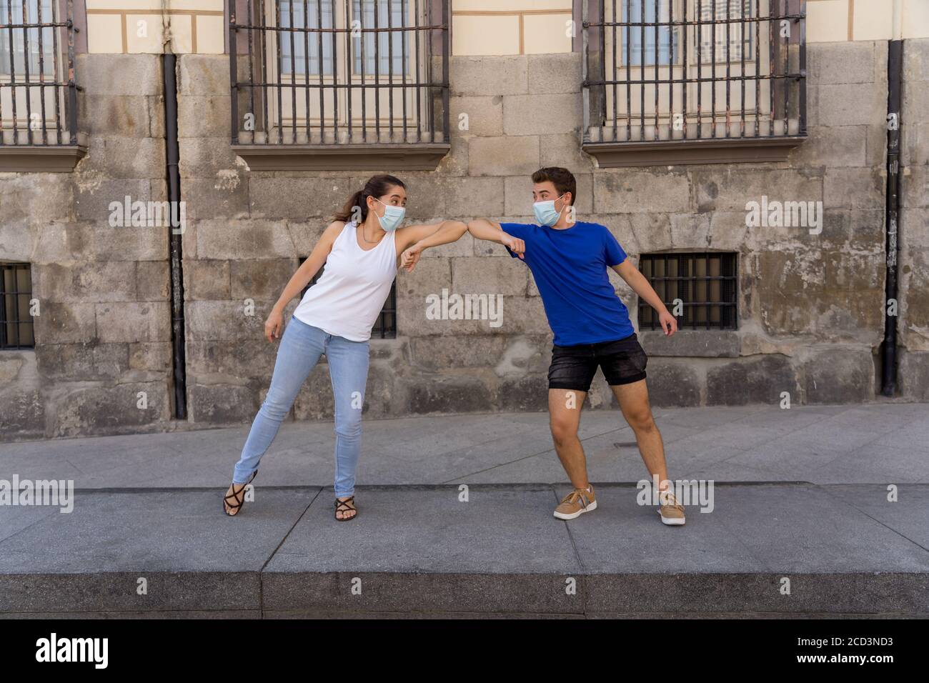 New normal greetings shaking covid hi-res stock photography and images ...